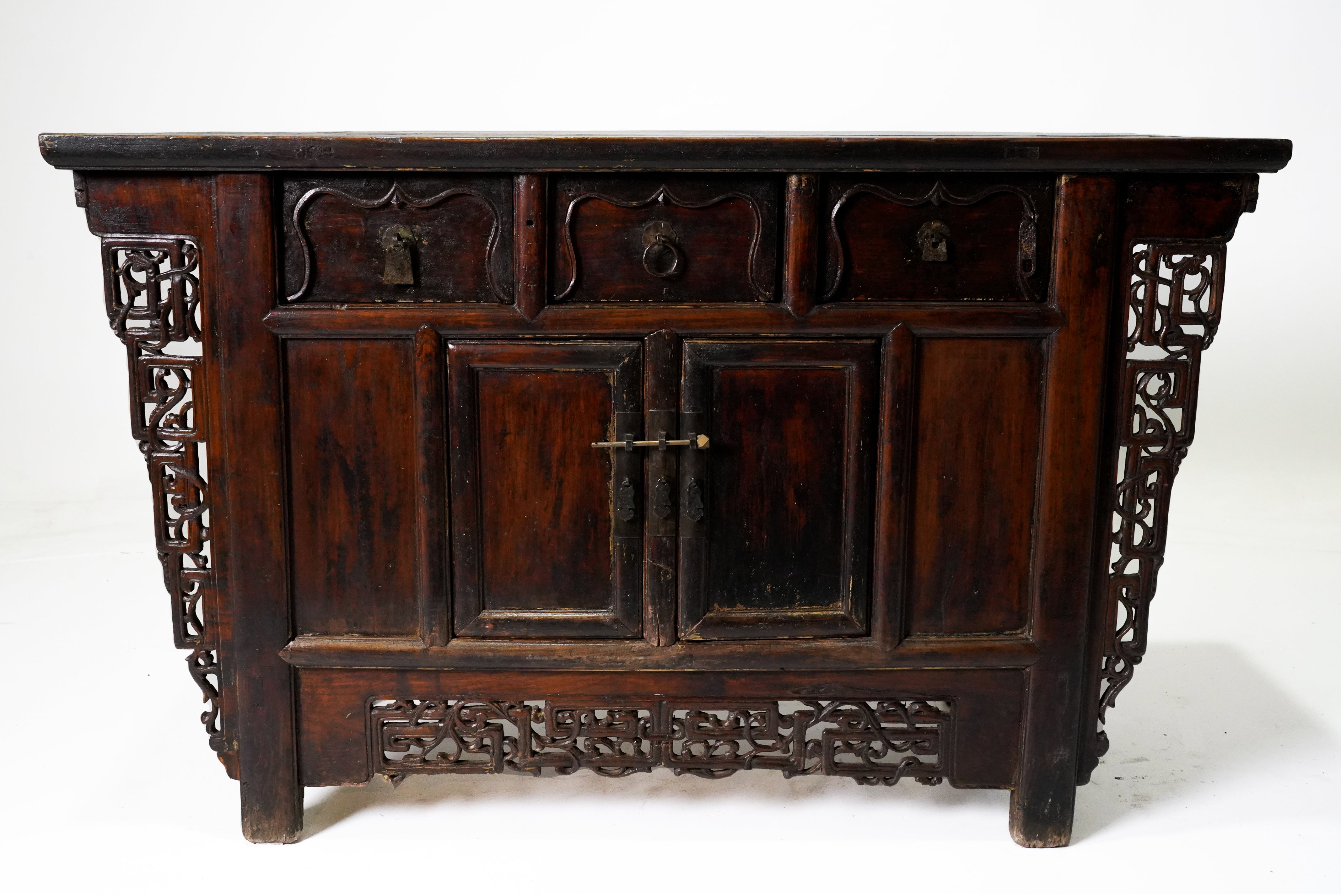 Butterfly Style Storage Cabinet With Carved Spandrels